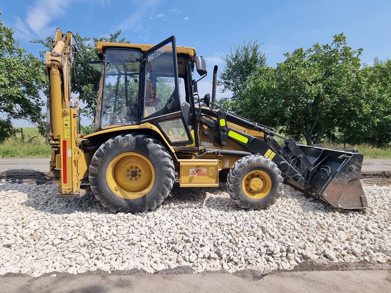 Buldoexcavator CATERPILLAR 428C anul 1999
