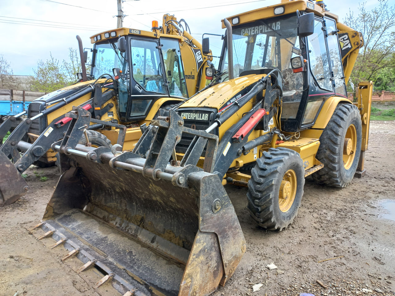 Buldoexcavator Caterpillar